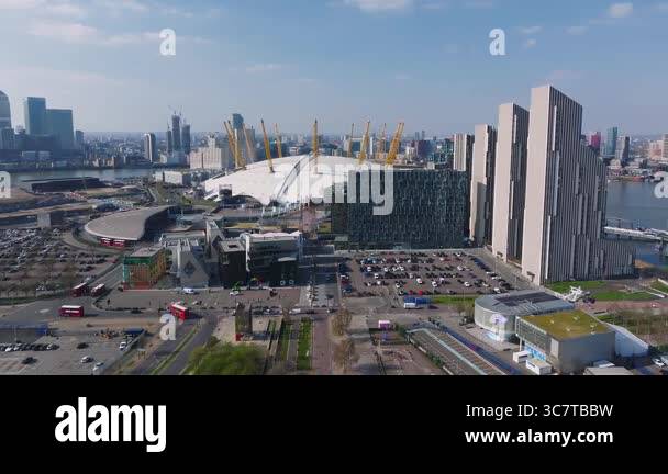 Aerial pan of London featuring the O2 Arena, River Thames, the Tide ...