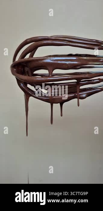 Dark chocolate drips from the whisk Stock Video Footage - Alamy