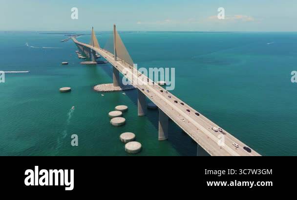 Highway road traffic driving over Sunshine Skyway Bridge in Florida ...