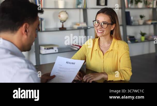 Confident young professional applicant woman talking to employee on ...