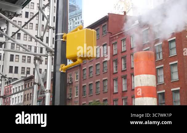 Steam vapor vented, New York City Water street, orange vapour tube ...