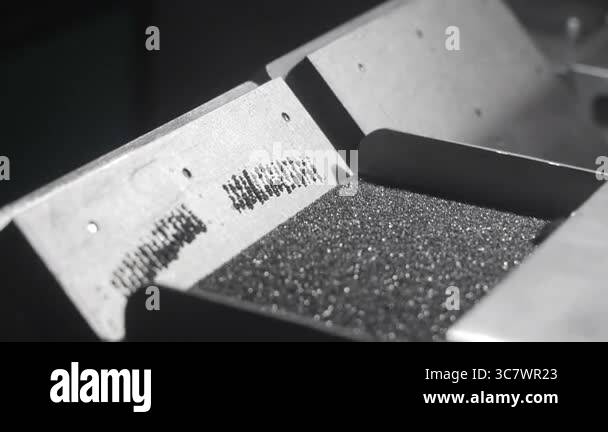 Close-up of metal tray with abrasive diamond particles during disc manufacturing, Industrial ...