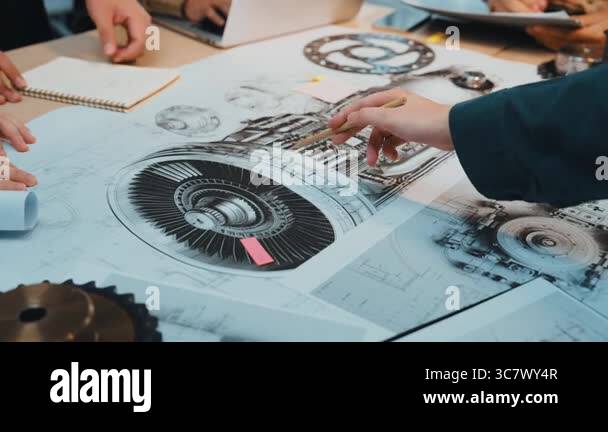Engineering professionals engage in an in-depth discussion over ...