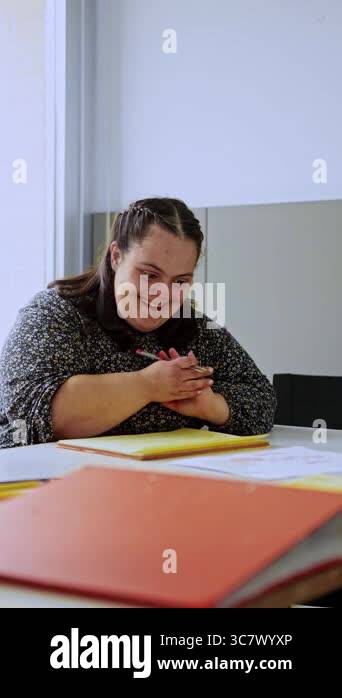 A joyous woman with down syndrome disability participates in ...