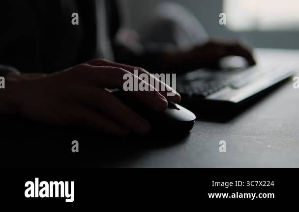 Close-up of man hand using a computer mouse in home office setup ...