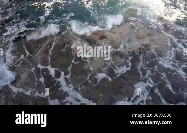 Background blue waves of the sea with sea foam. top view Stock Video ...