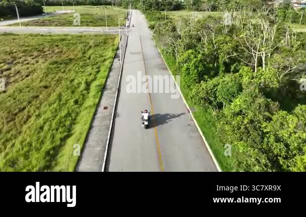Man riding a motorcycle in Florianopolis, aerial view Stock Video ...