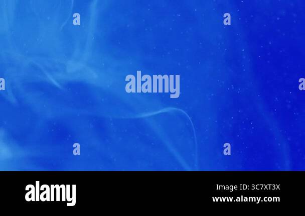 Water vortex. Mist effect. Defocused bright blue colorful splash paint ink cloud magic smoke ...