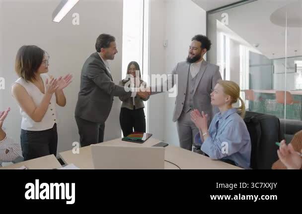 A skilled team celebrates their success in closing a significant ...