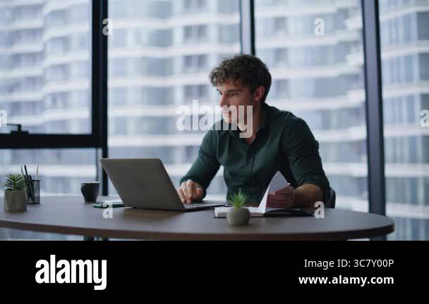 Excited trader rejoicing win browsing laptop at company workspace ...