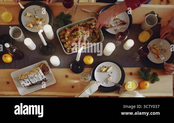 Overhead view of a family enjoying a delicious Christmas dinner ...