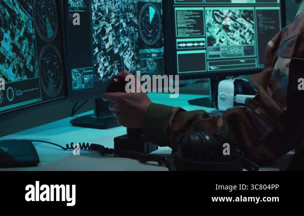 Dramatic scene of a soldier in a dimly lit military control room ...