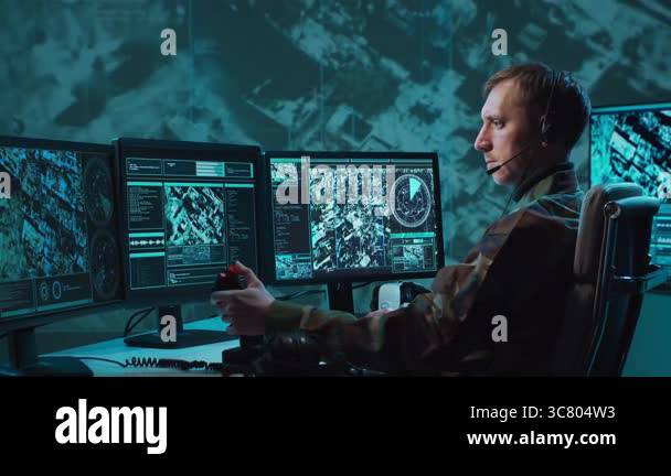 Dramatic scene of a soldier in a dimly lit military control room ...