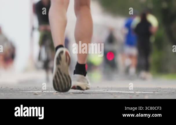 Close up of runners legs and feet competing in marathon race Stock ...