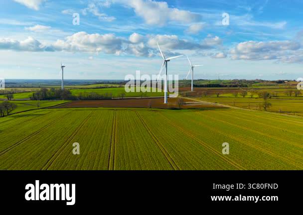 Wind turbine, green electricity and farming. Wind turbine working to ...