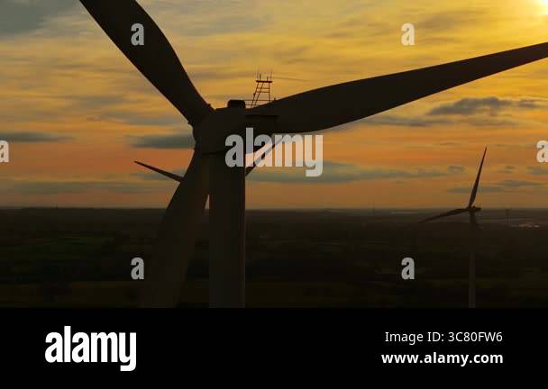 Scenic aerial view of wind turbines farm at sunset. Wind turbine ...