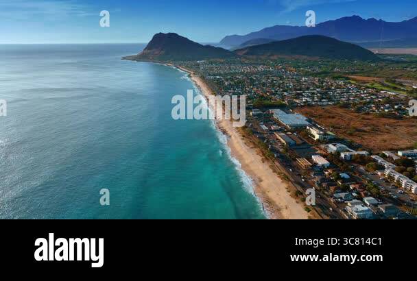Beautiful turquoise waterscape of the Pacific Ocean with a narrow sandy ...