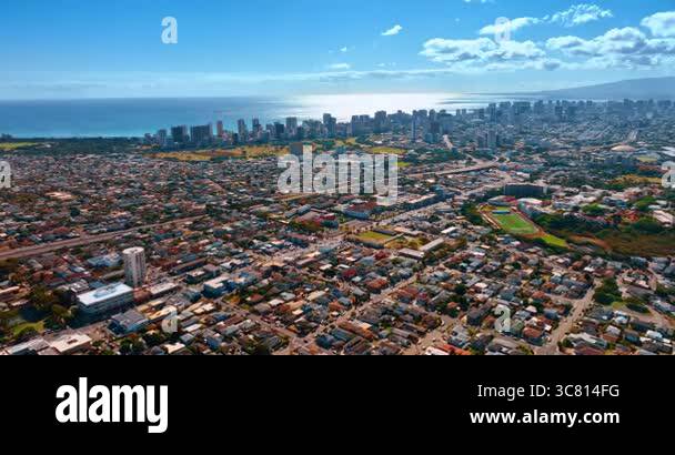 Sun dazzles the scenery of vast modern cityscape of Honolulu, Hawaii ...