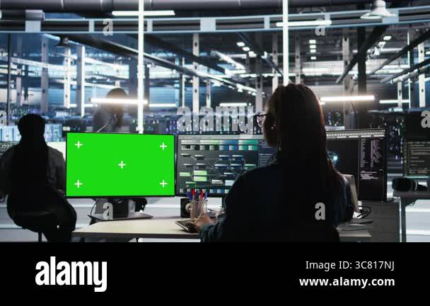 Server farm engineer using node tree systems on green screen PC to categorize unstructured data ...