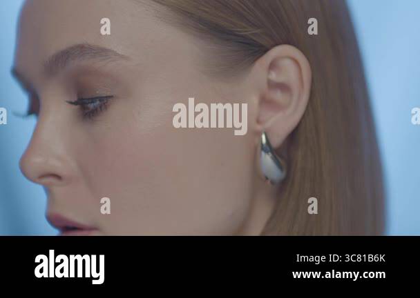 Close-up portrait of a young woman with a powerful and focused ...
