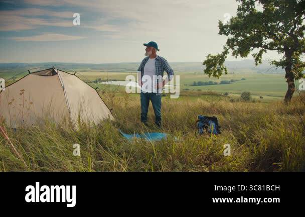 Active Aging, Vital Longevity. Senior Man Stands Beside His Tent ...