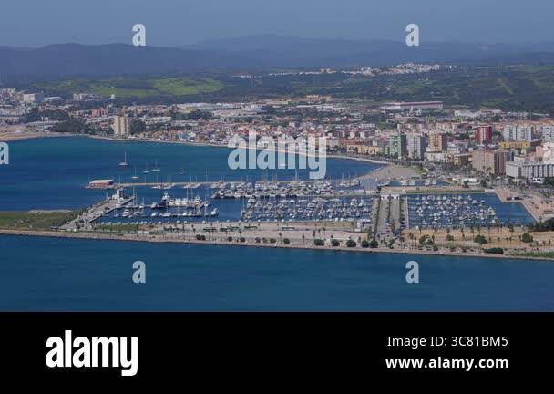 Boats resting in Alcaidesa Marina with city of La Linea de la ...
