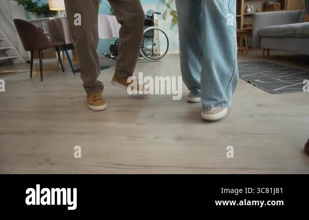 Low section closeup of unrecognizable elderly residents feet as they ...