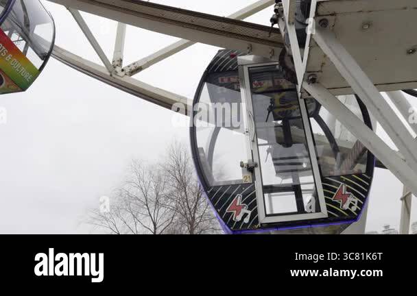 Ferris wheel cabin rotating gently in an amusement park Stock Video ...