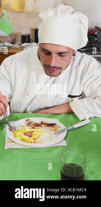 Boy Chef Eats French Fries And Roast Chicken At His Serving Table Stock ...