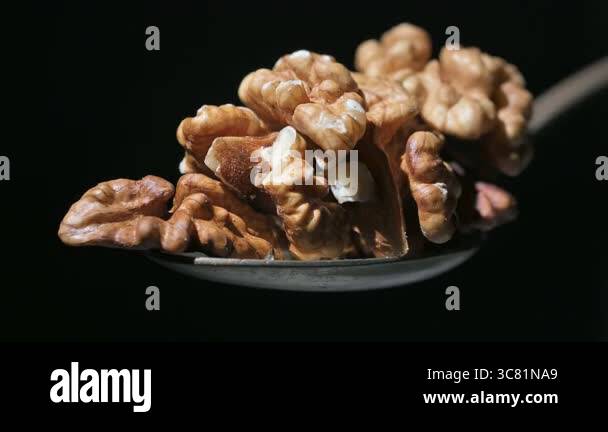 Walnut Pieces In A Rotating Spoon Stock Video Footage - Alamy