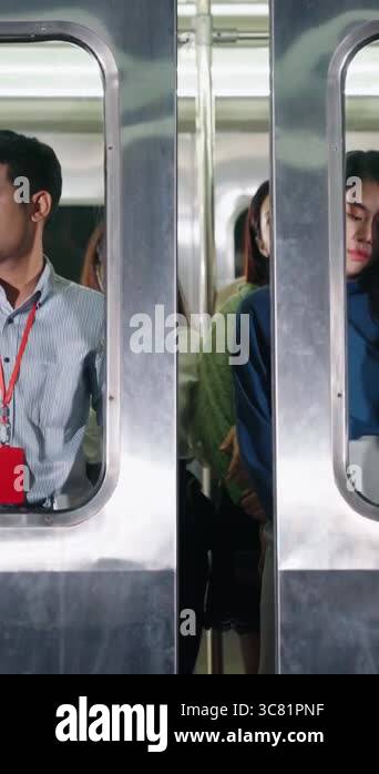 Crowd of people on a busy crowded public subway train travel ...