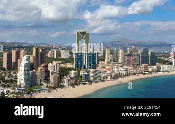 A stunning aerial view of a vibrant beachfront city with an impressive ...