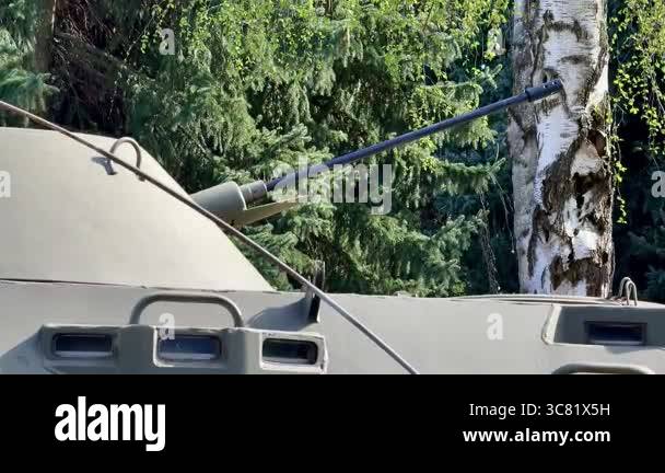 A closeup view of a military tank turret is strategically positioned ...