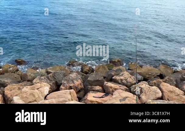 A stunning and picturesque coastal view showcasing a rocky shoreline ...