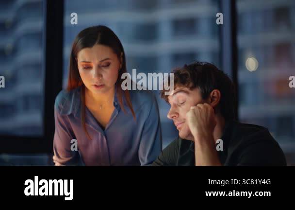 Woman helping sad colleague solving hard tasks at laptop overtime closeup. Businesswoman ...