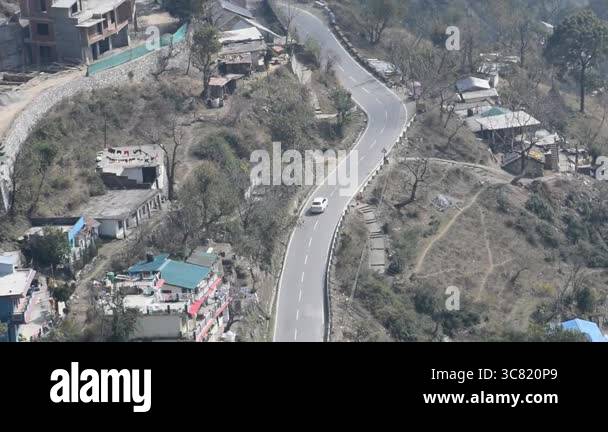 Aerial top view of traffic vehicles driving at mountains roads at ...