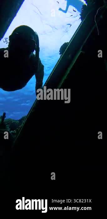 Freediver inside the Vaavu Shipwreck underwater near Keyodhoo Island in ...