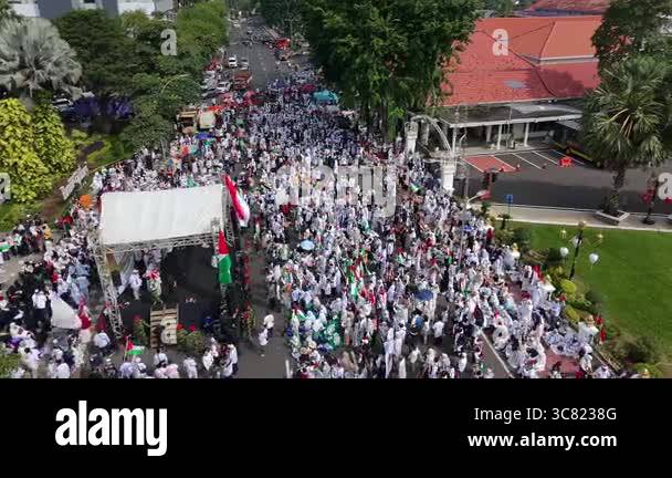 April 19, 2025. Surabaya, Indonesia. Aerial view of A large urban rally ...