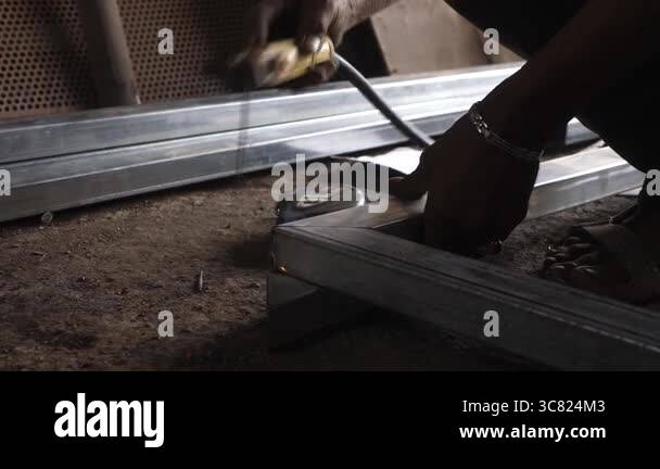 close up of man's hand grinding without using safety gloves. unsafe ...