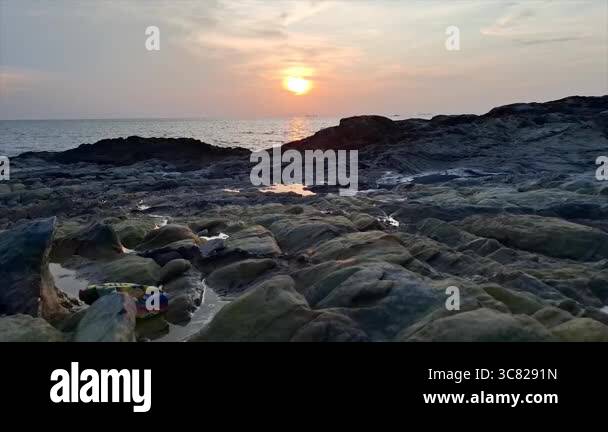 A calm and beautiful sea view at sunset. With the foreground dominated ...
