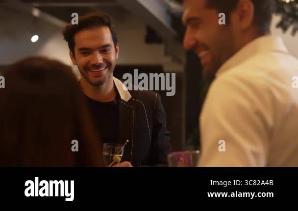 Focusing smart man lively talking with friends group while enjoy ...