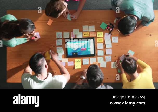 Top down view of programmer brainstorming and planning about web design ...