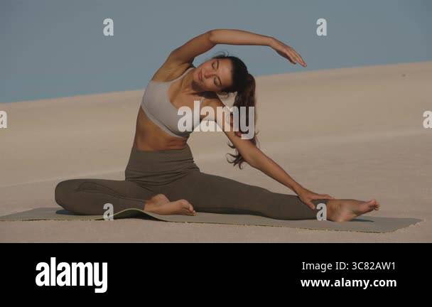 Stretching woman in outdoor exercise, happy doing yoga stretches after ...