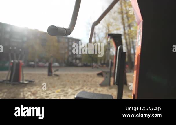 Fitness trainer set up on open-air sports ground. Assistance for ...