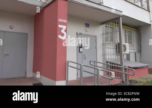 Entrance of residential building features sturdy metal door with ...