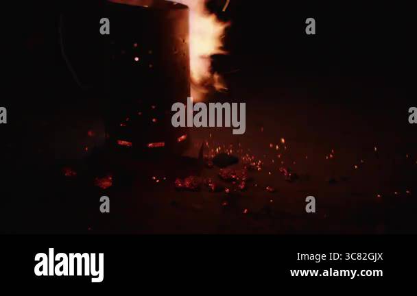 A powerful flamethrower sets a fire pit ablaze, sending flames roaring ...