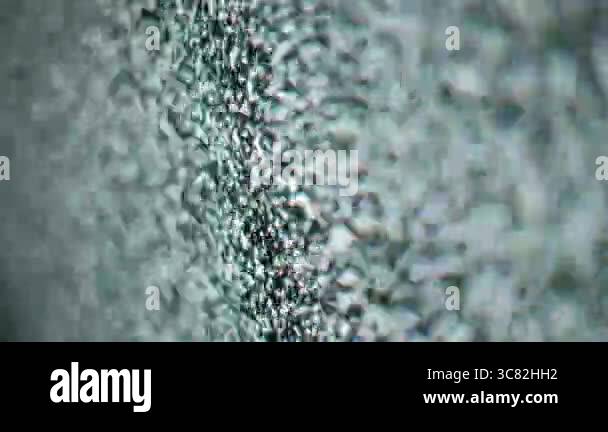 Close-up angled shot captures flickering white noise static on an old ...
