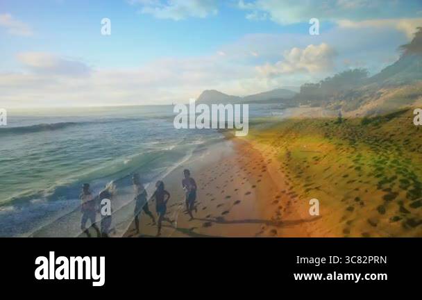 Running along scenic beach, people with waves and mountains in ...