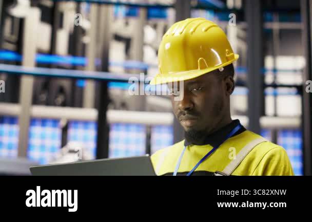 Industry 4.0 plant engineer following maintenance procedures to mend ...