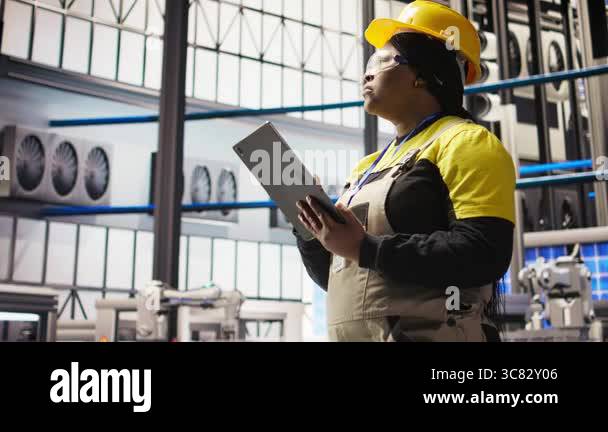 Smart factory engineer using tablet to analyze IoT sensors data ...